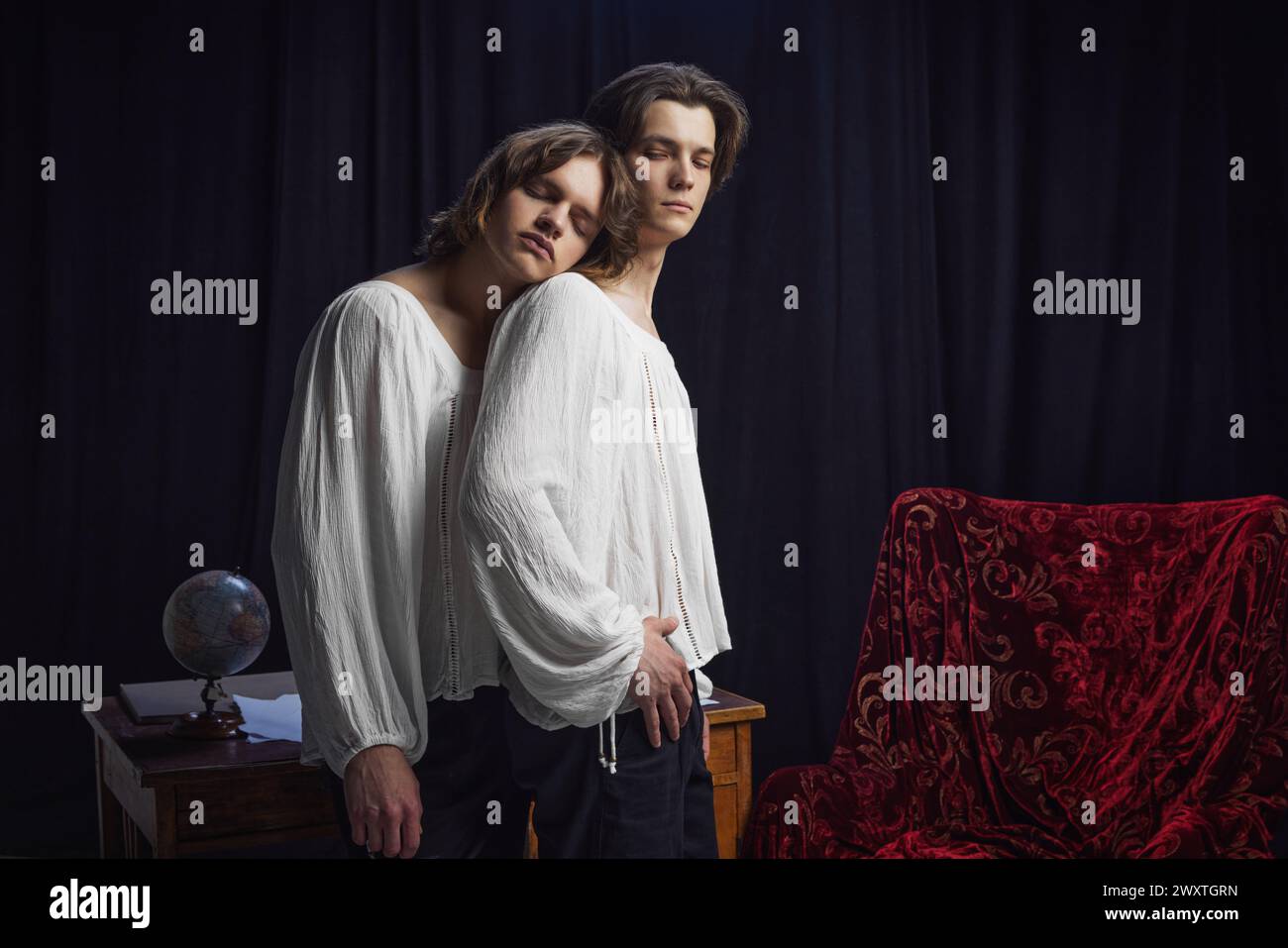 Portrait of one young man leaned on shoulder of his friend, both ...