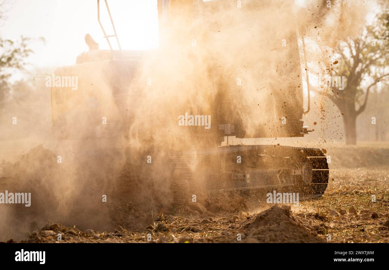 Backhoe working by digging soil at construction site. Excavator working ...