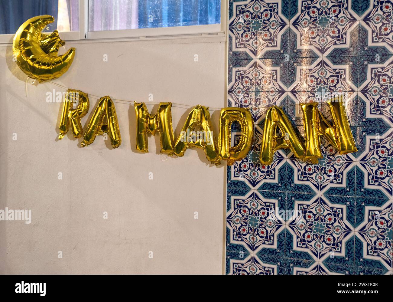Golden words RAMADAN made of inflatable balloons, on a wall Stock Photo ...