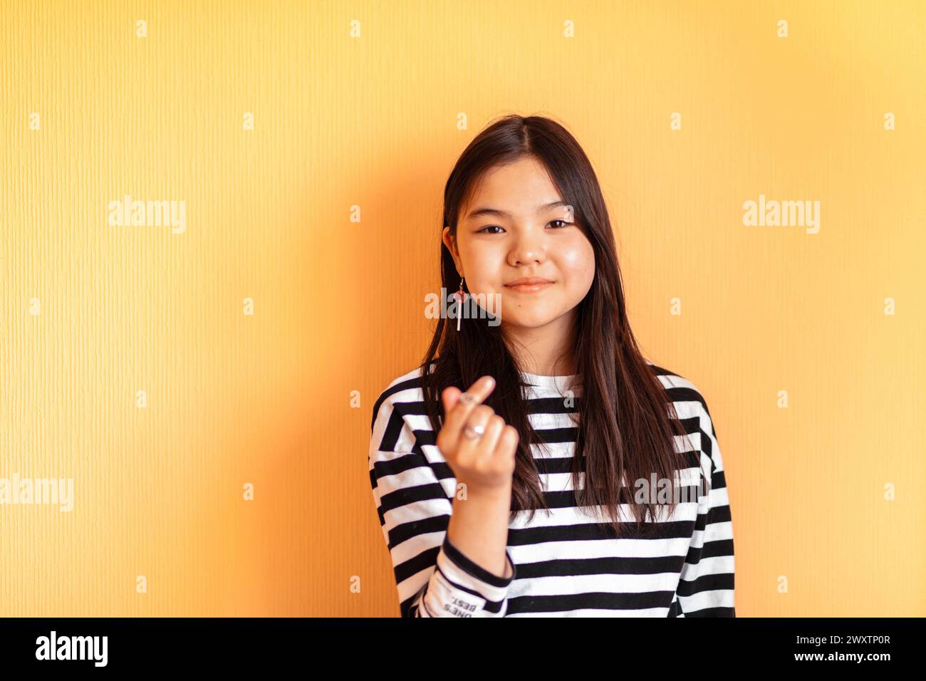 Vibrant Teen : A casually stylish girl with a joyful demeanor offers a ...