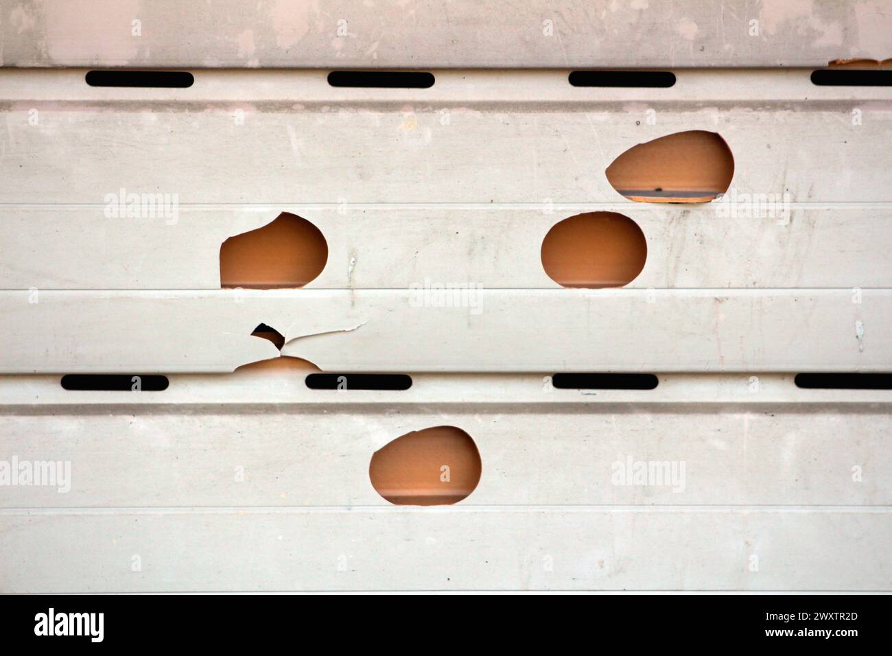 Multiple large hail damage holes on broken family house dirty old ...