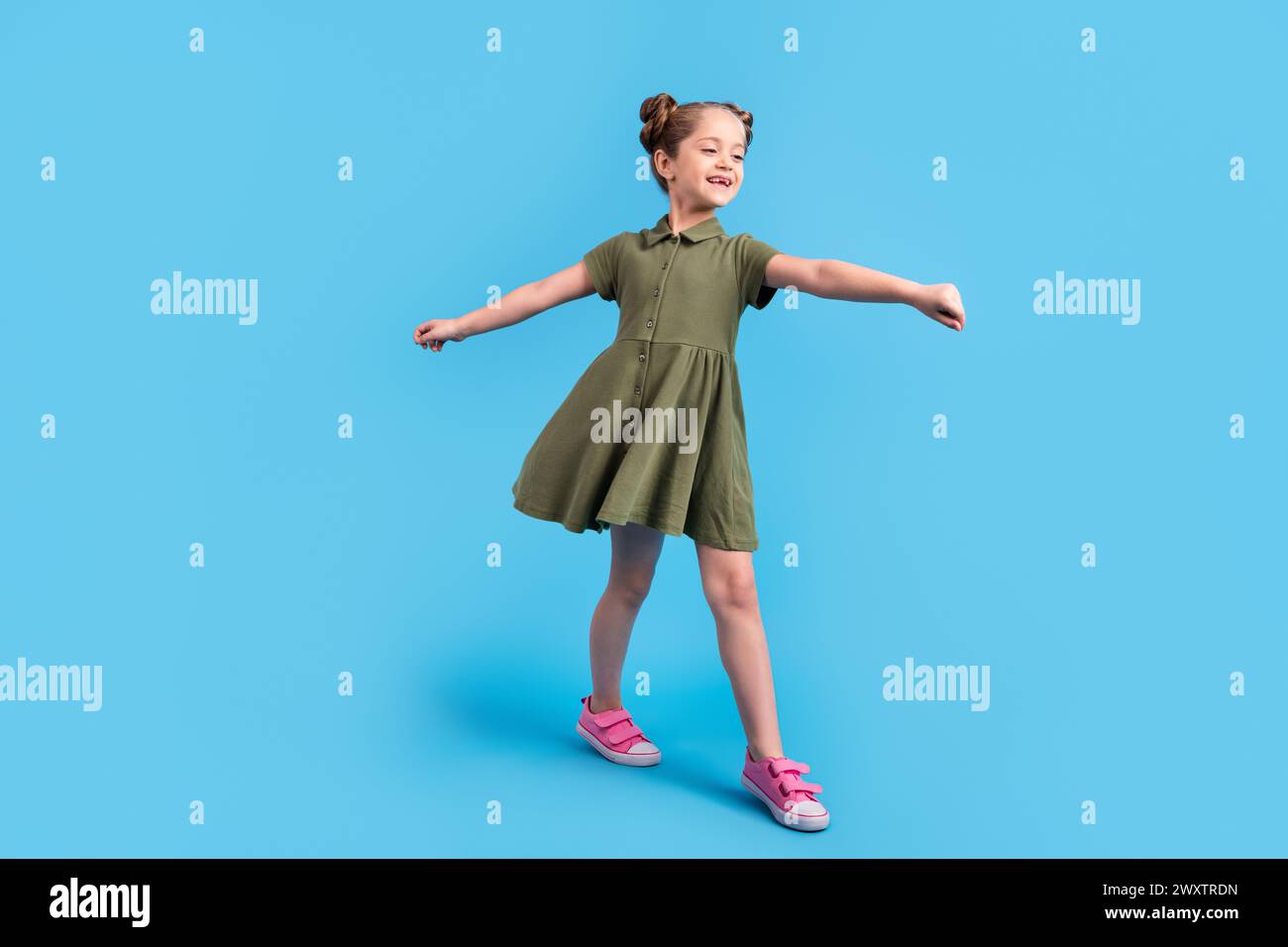 Full length photo of positive schoolkid making dance sport moves ...