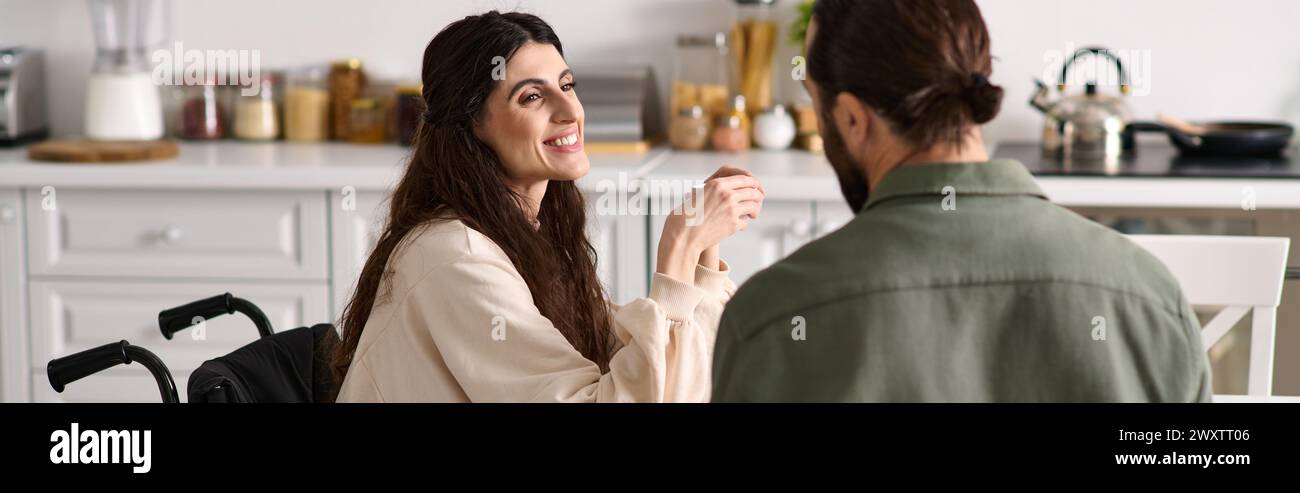 positive man enjoying breakfast with his disabled merry wife in ...