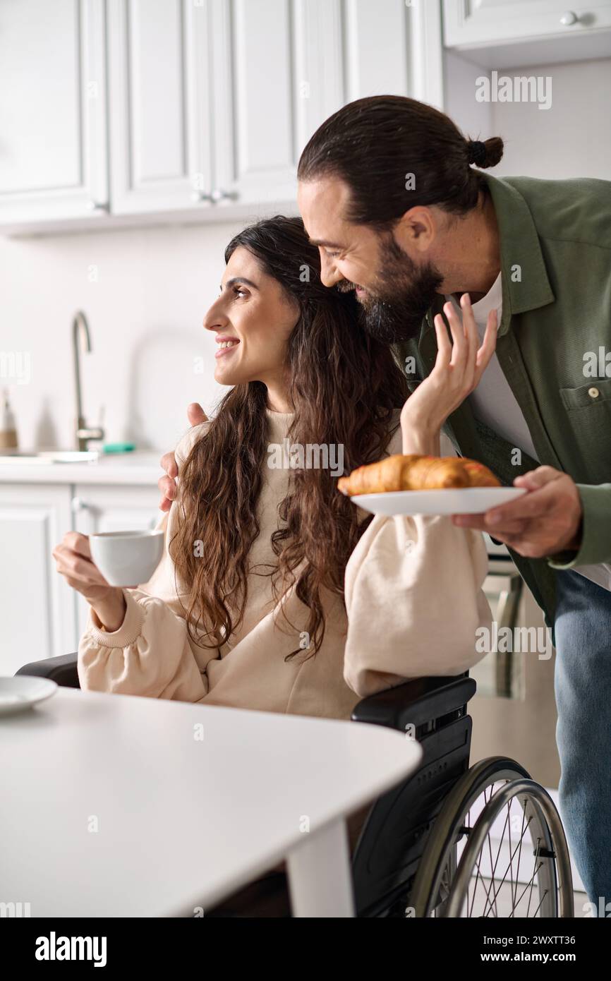 jolly beautiful disable woman in wheelchair enjoying coffee with her ...