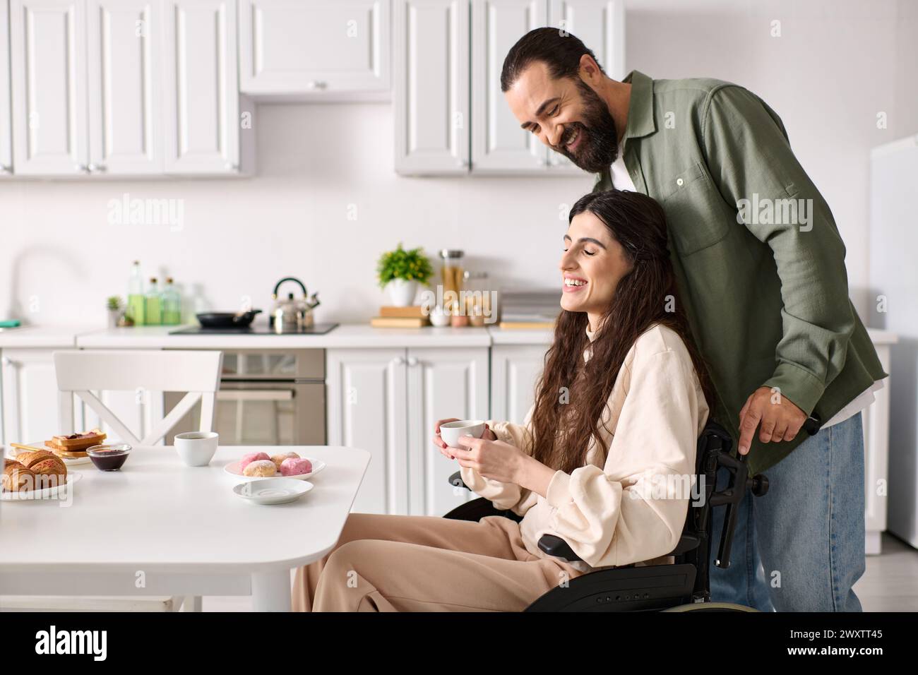 positive loving man spending time at breakfast with his disabled ...
