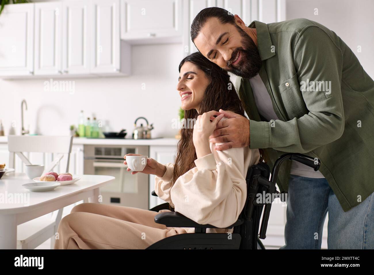 positive loving man spending time at breakfast with his disabled ...