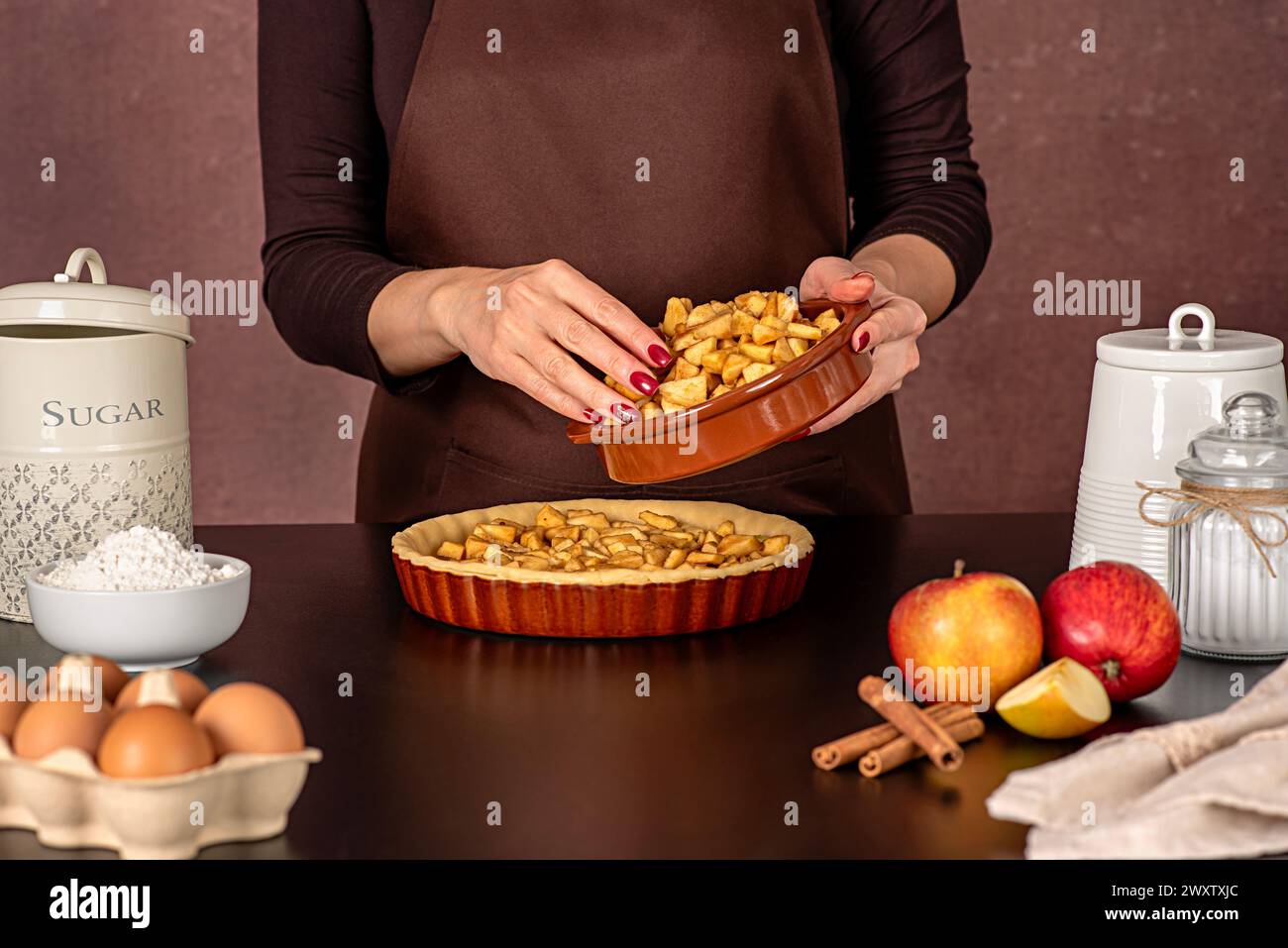 Food photography of raw apple pie; cinnamon; american dessert; dough; cooking; flour ...