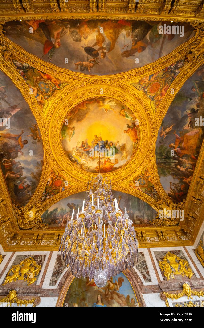 A grand chandelier hangs from the ornate ceiling frescoes of Chateau ...