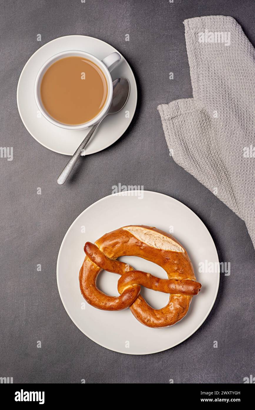 Food photography of coffee with milk, pretzel, cappuccino; bavarian ...