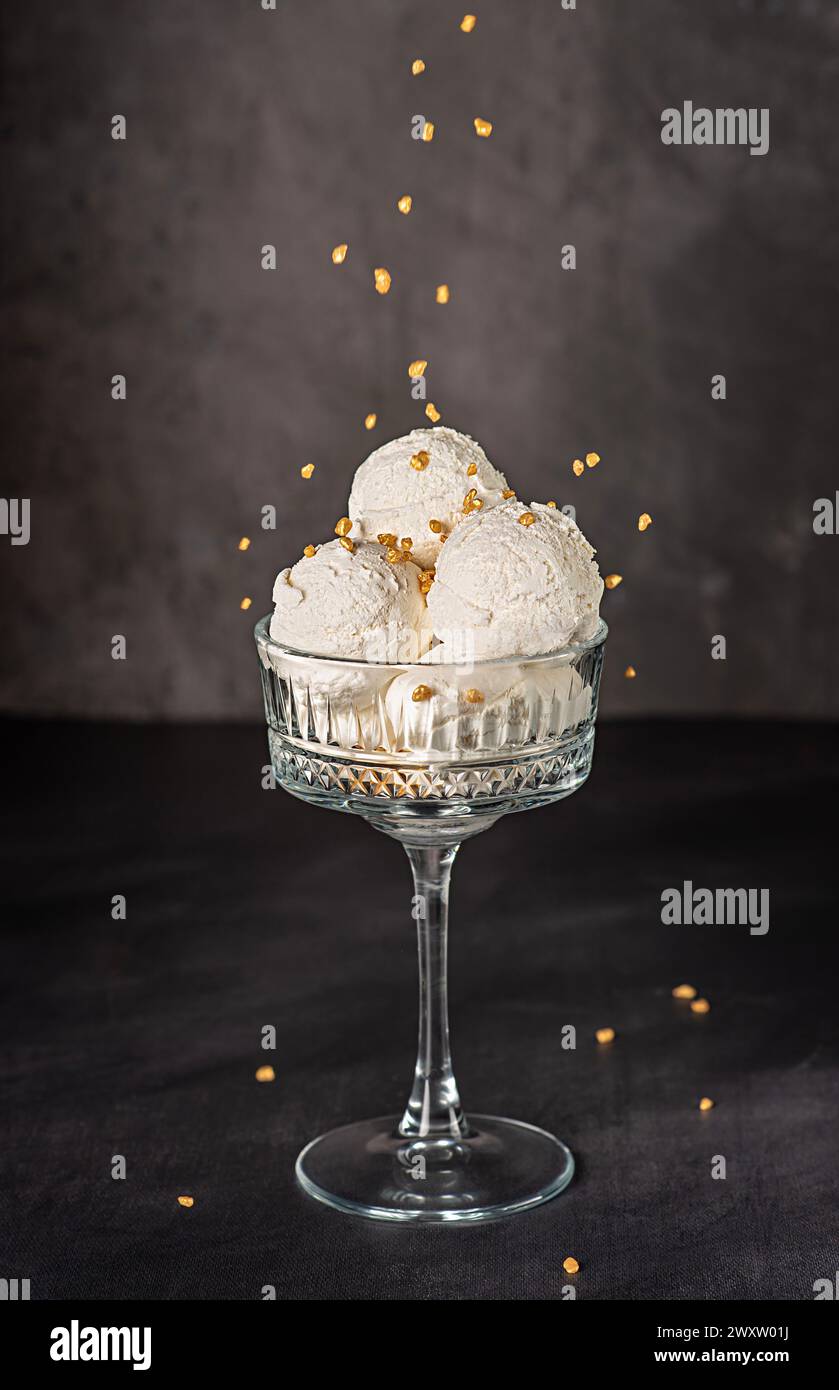 Food photography of vanilla ice cream; frozen; cool; scoop; glass ...