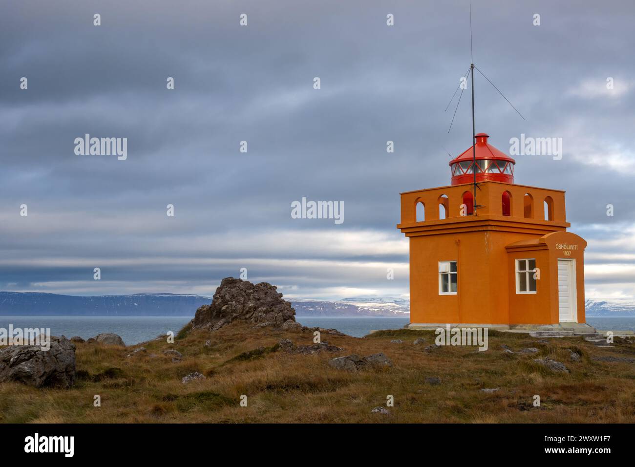 Bright orange facade of the lighthouse. Red tower with the light ...
