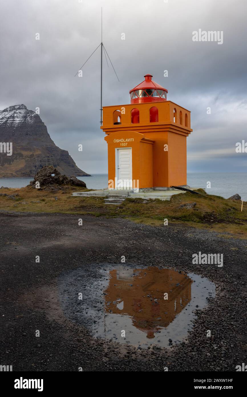 Bright orange facade of the lighthouse. Red tower with the light ...