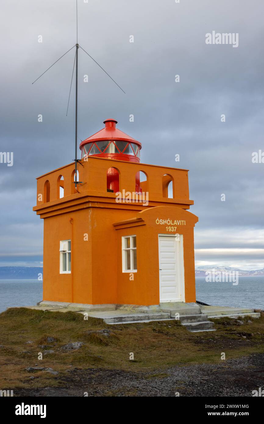 Bright orange facade of the lighthouse. Red tower with the light ...