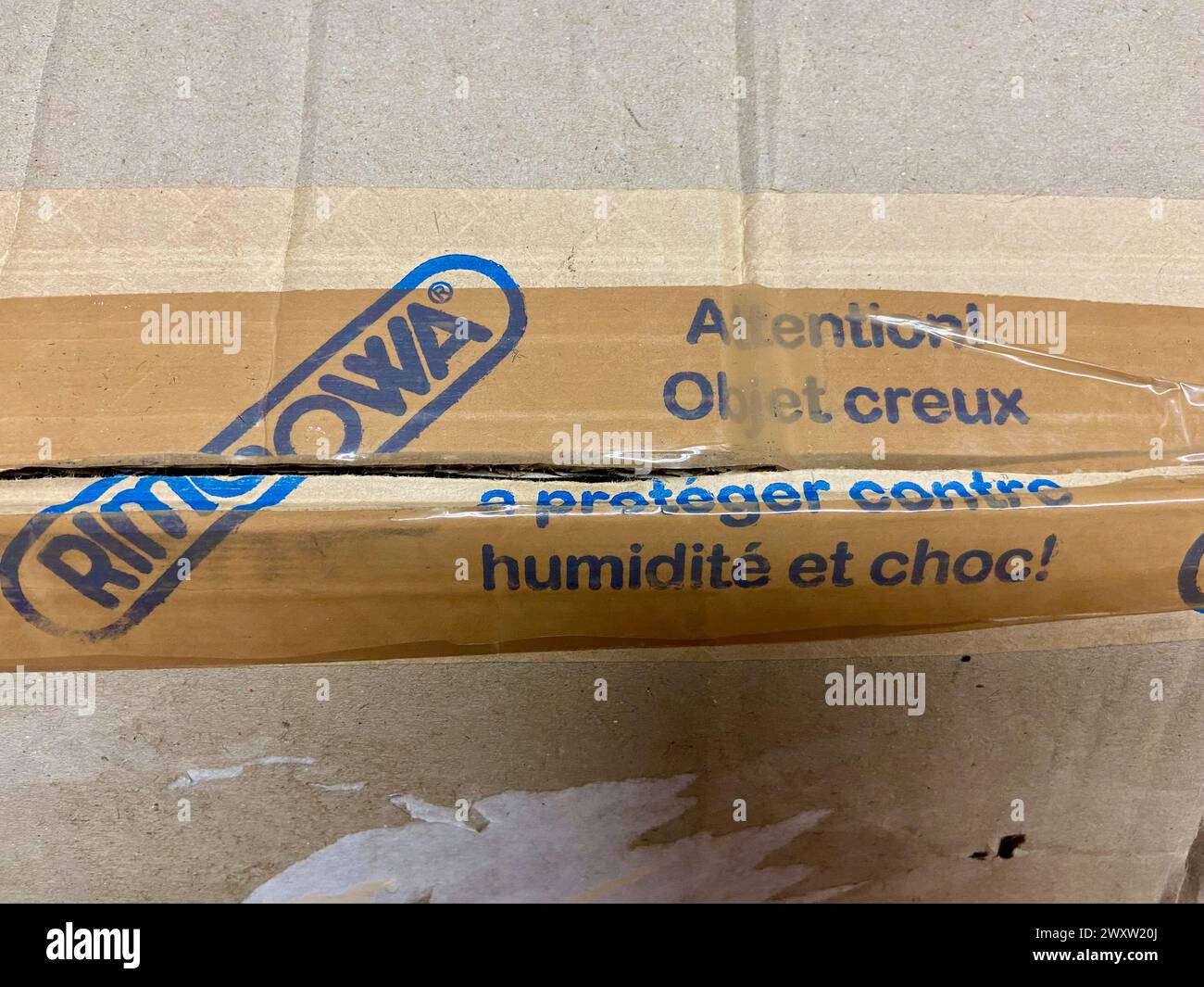 cardboard rimowa box with german language labels and distinctive design ...