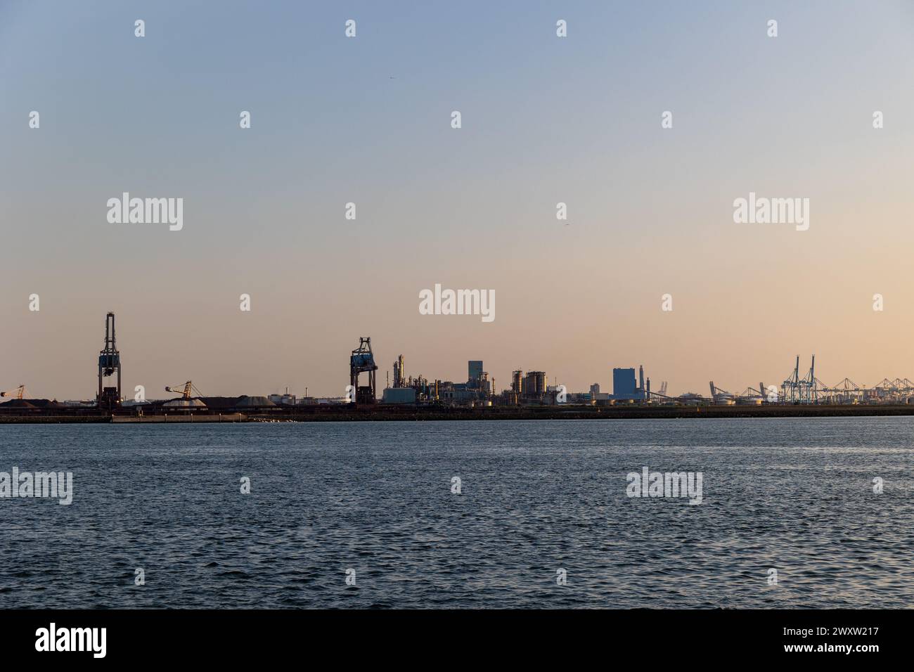 Ships float across the North Sea. Windmills in the background. Sea port ...