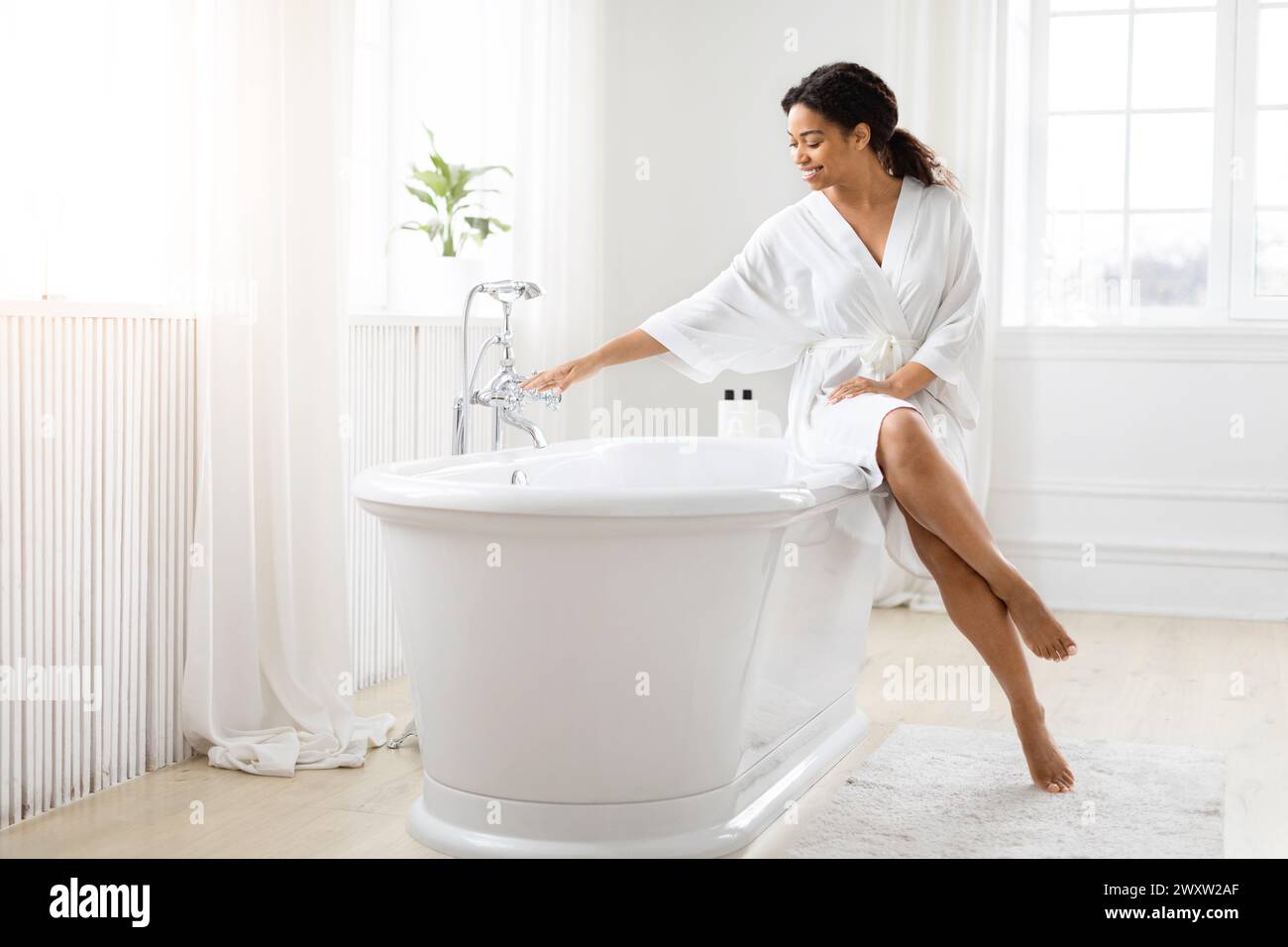 Stepping into bathtub hi-res stock photography and images - Alamy