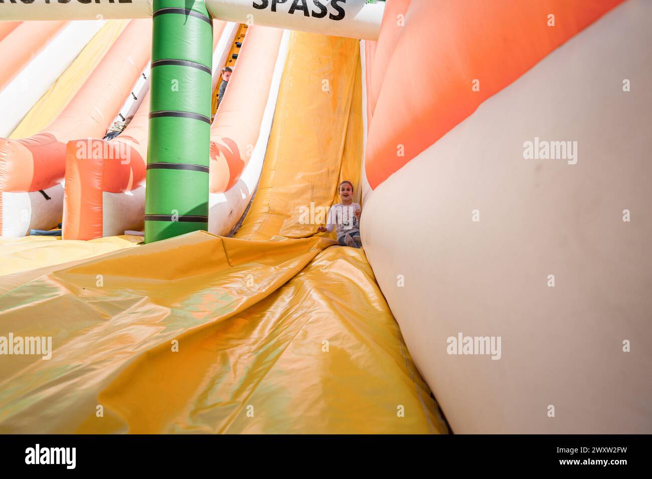 Bad Gleichenberg, Austria - March 30th 2024 - A girl on an inflatable ...