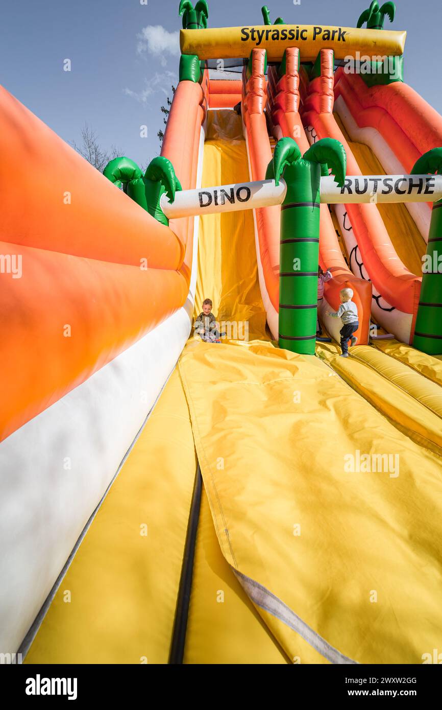 Bad Gleichenberg, Austria - March 30th 2024 - A boy on an inflatable ...