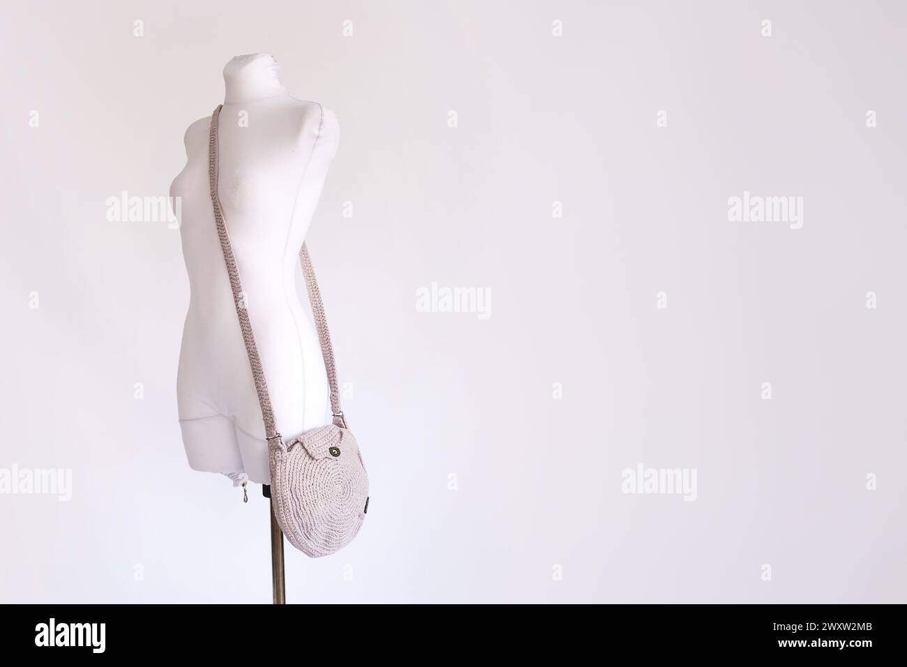 Artisanal Crocheted Crossbody Bag on Mannequin Display Stock Photo - Alamy