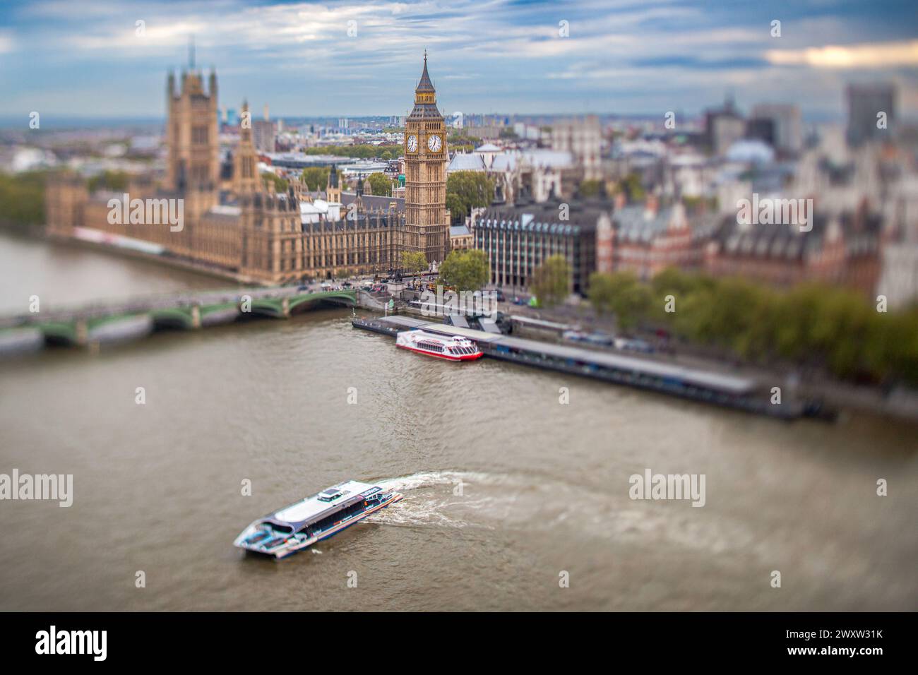 Westminster skyline with the Thames River in London, captured at dusk ...