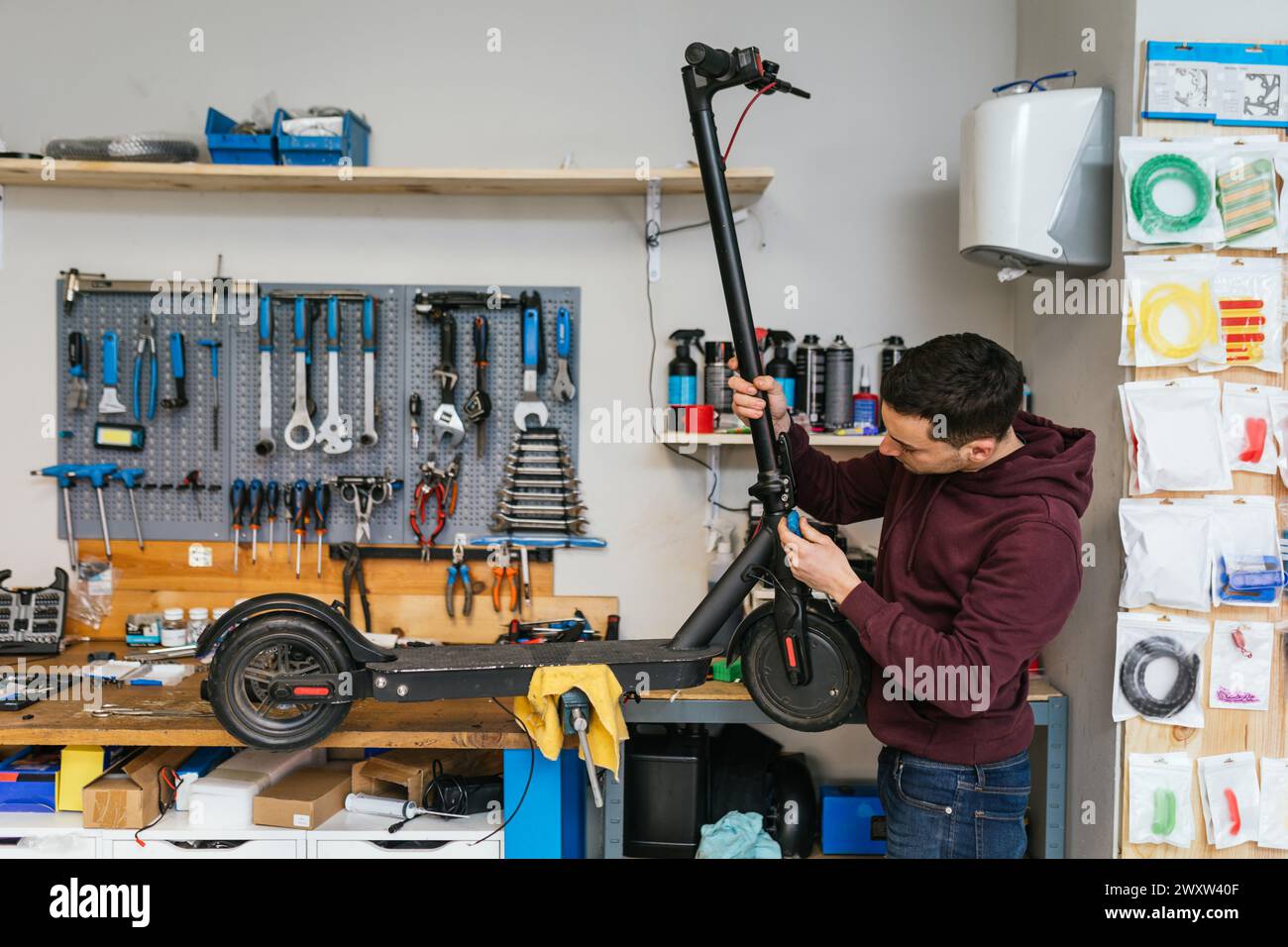 Mechanic repairing scooter hi-res stock photography and images - Alamy