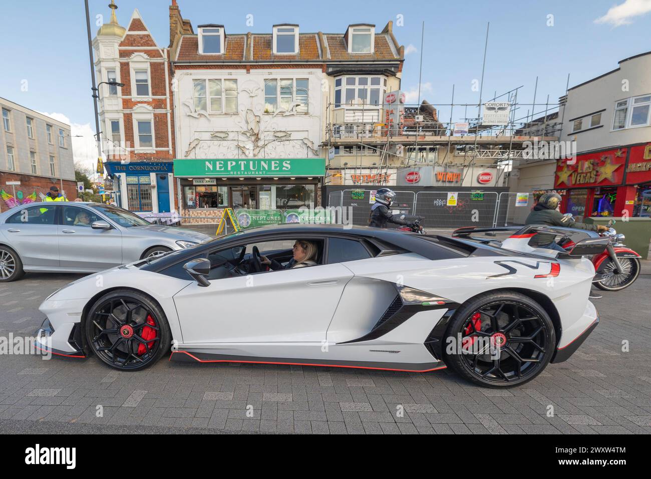 White Lamborghini Aventador with black/red accents parked near ...