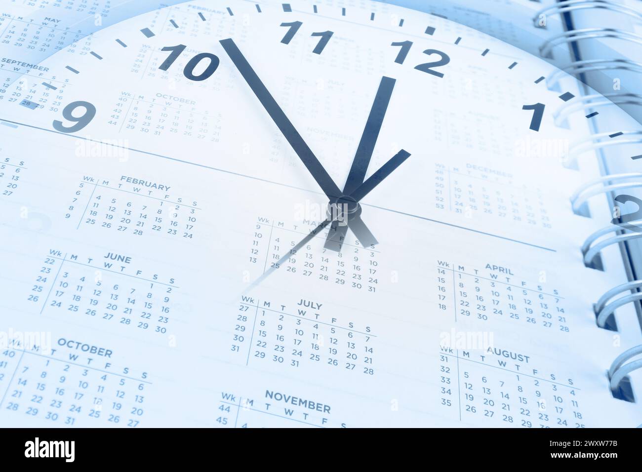 Clock face and calendar page. Time management Stock Photo - Alamy