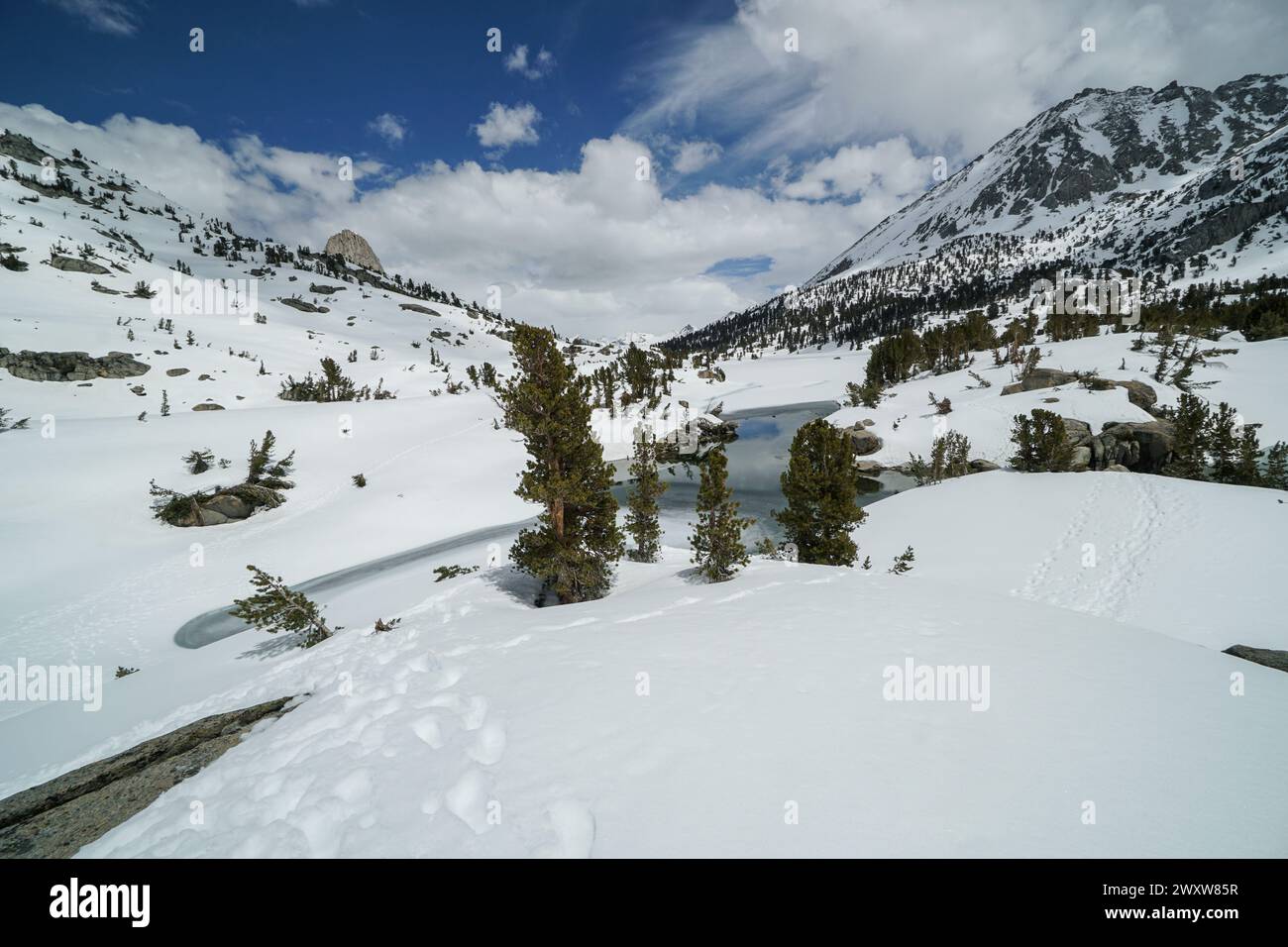 Pacific Crest Trail. A snowy mountain range with a lake in the middle ...