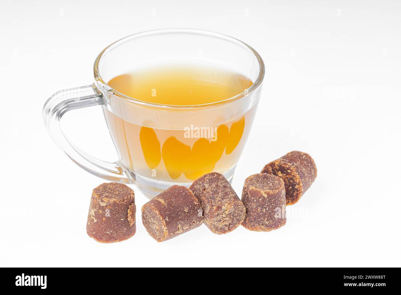 Piloncillo, ground piloncillo and piloncillo tea isolated on white ...