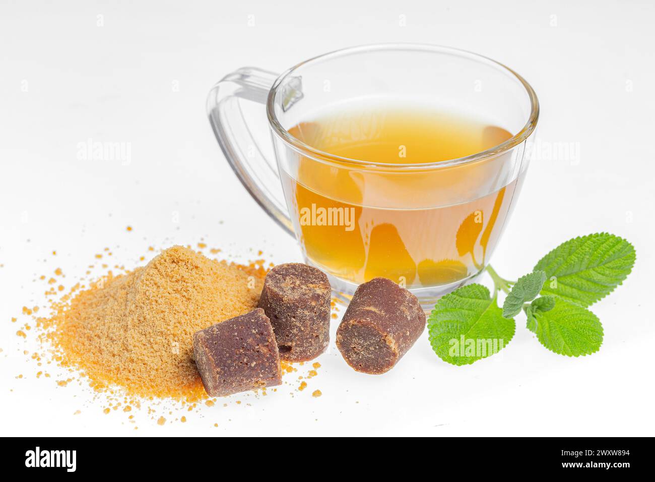 Piloncillo, ground piloncillo and piloncillo tea isolated on white ...