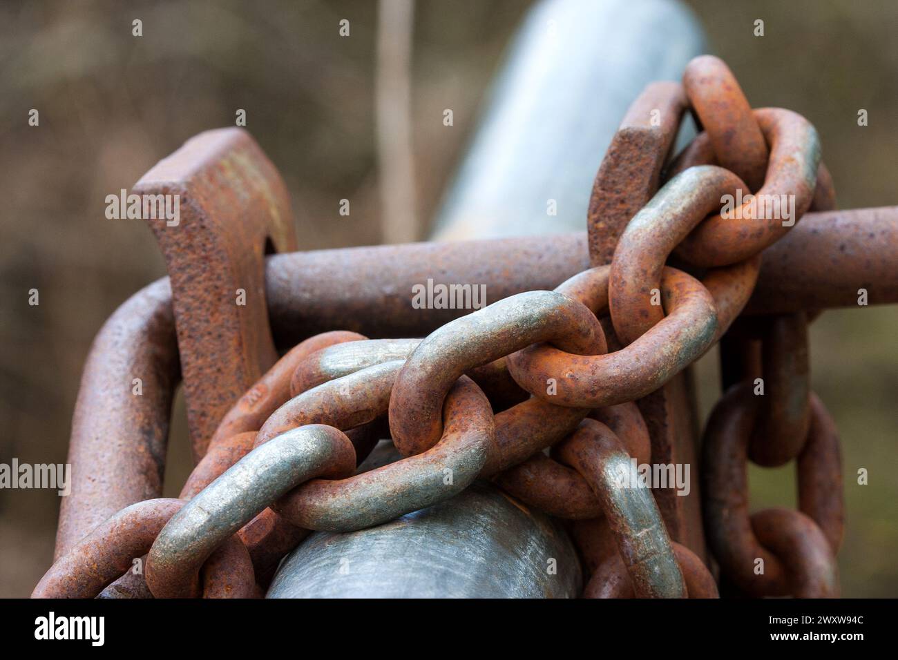 A symbol of demarcation and control. A locked barrier, secured with a ...