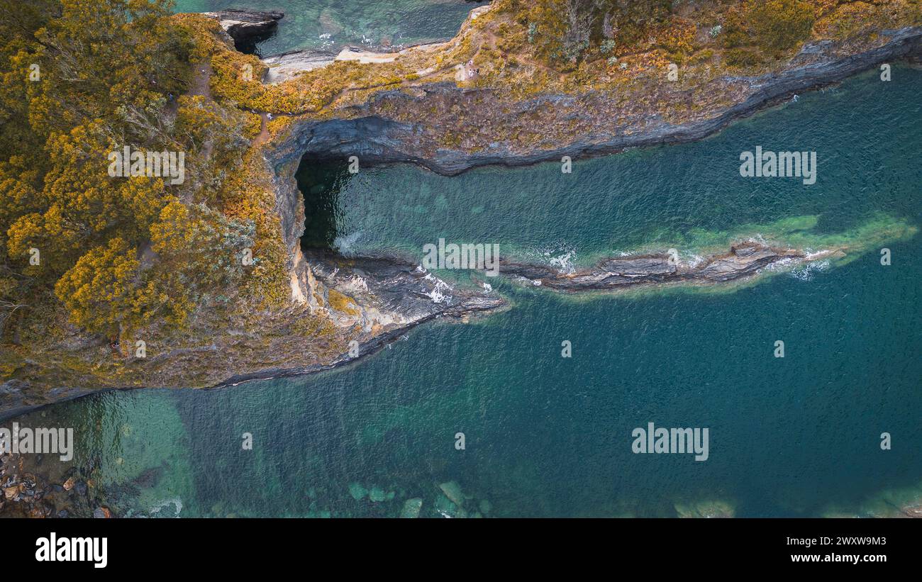 Coastal landscape with sharp cliffs and turquoise water seen from the ...