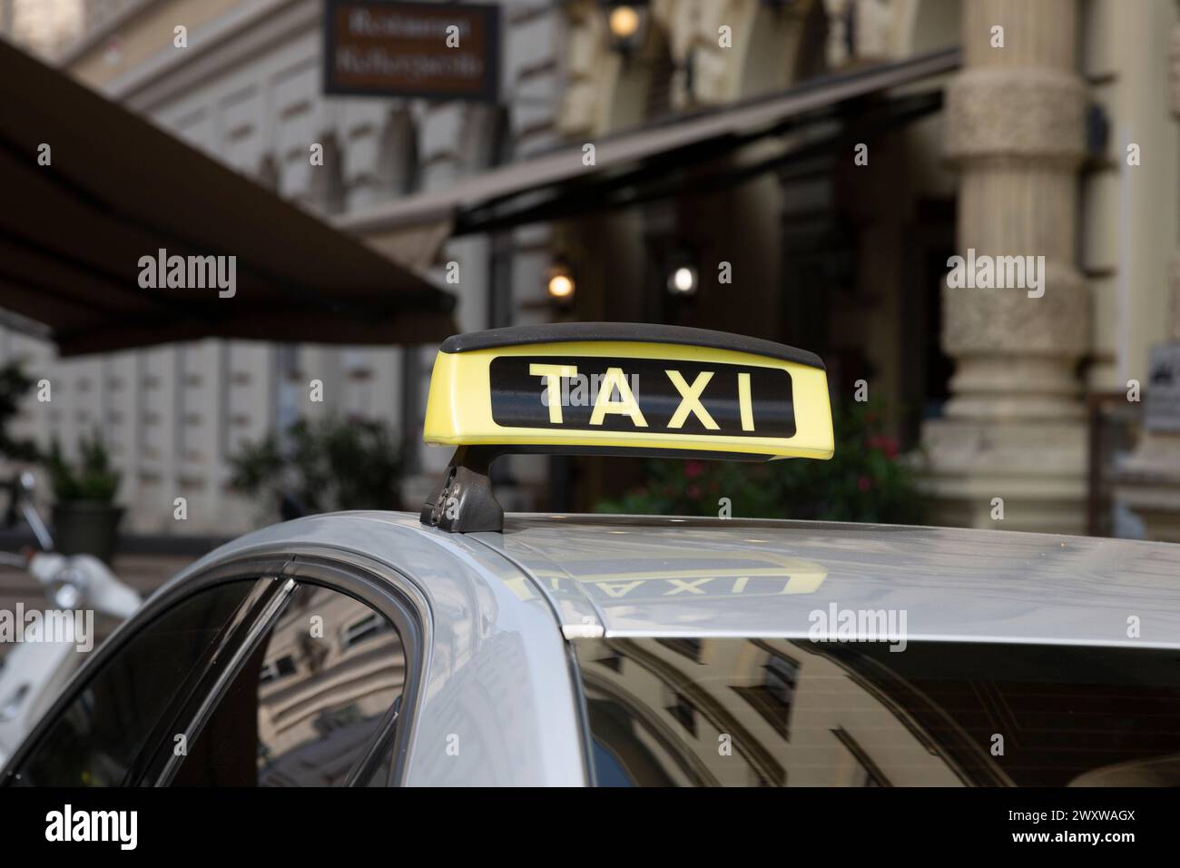 Checker taxi lighted rooftop car on a blurred background Stock Photo ...