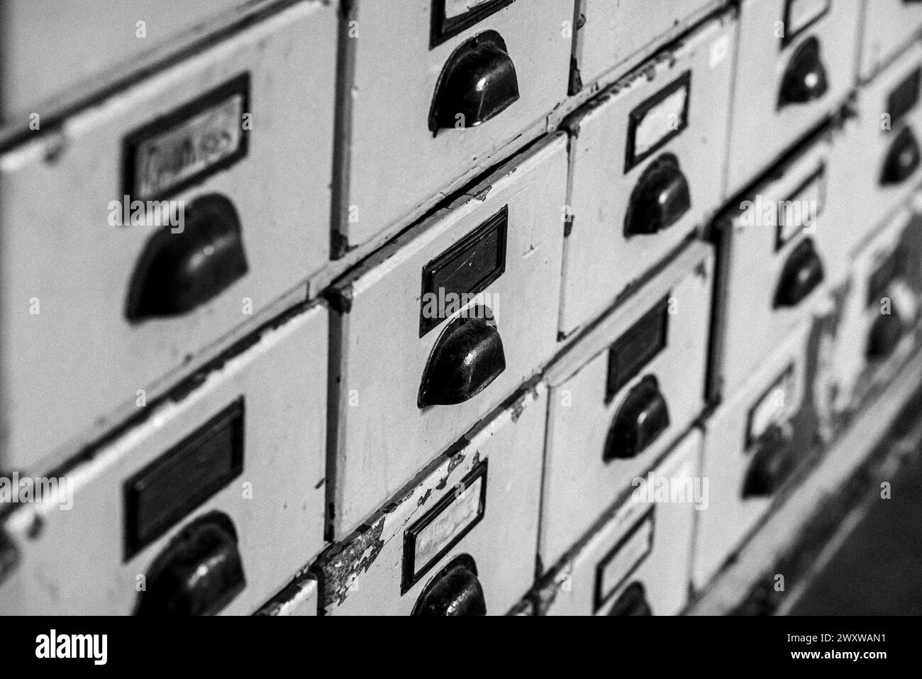 A filing cabinet filled with paperwork in its drawers Stock Photo - Alamy