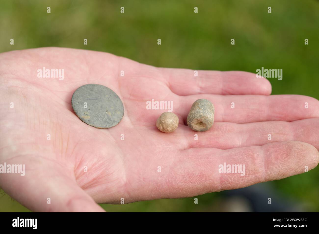 Lead and pewter finds after a metal detecting session in a field. A ...