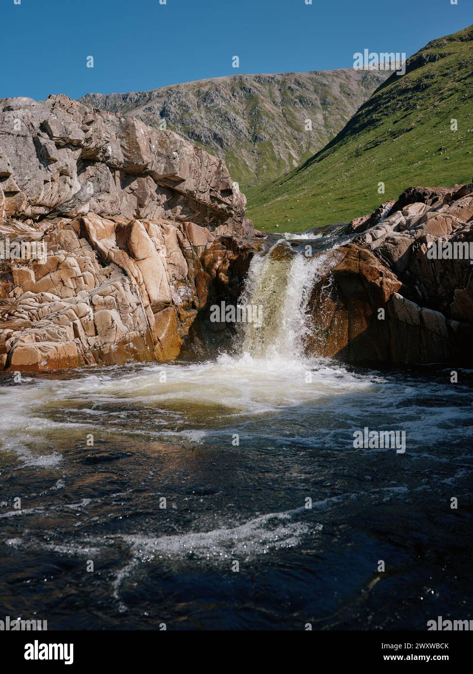 A plunge pool cascade River Etive, Glen Etive pink red granite ...