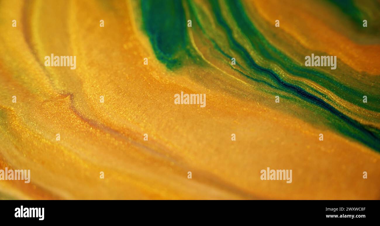 Shiny paint. Sparkling sand texture. Defocused golden yellow green ...