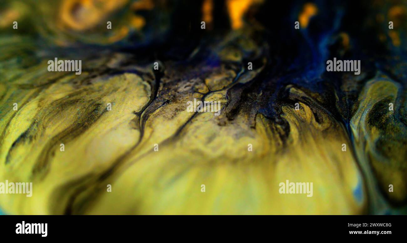 Ink spill. Glitter liquid texture. Defocused black blue yellow color ...