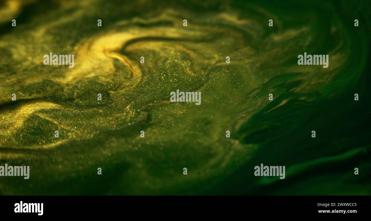 Glitter fluid texture. Shiny ink drip. Defocused green yellow color ...