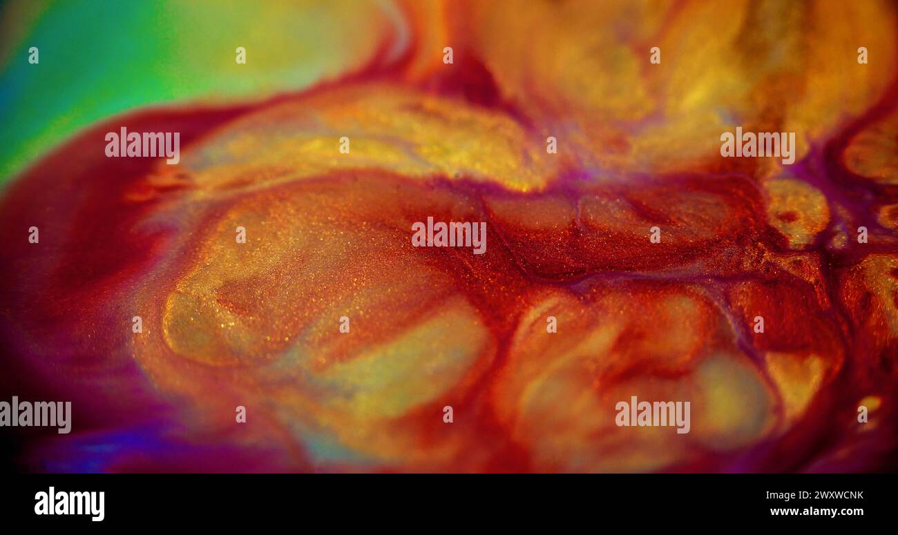 Glitter fluid spill. Shiny paint. Blur red yellow purple green color ...