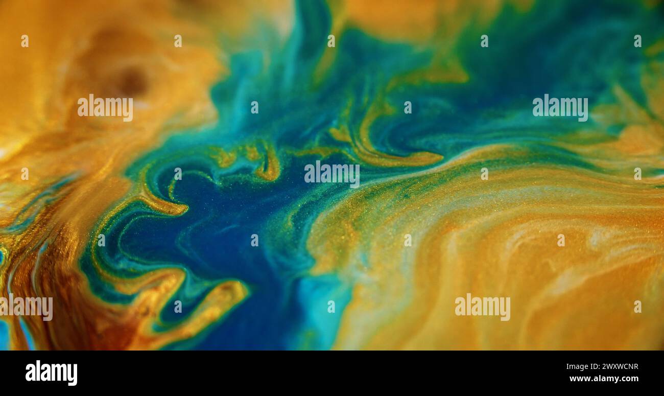 Shiny ink spill. Liquid glitter texture. Defocused blue golden color ...