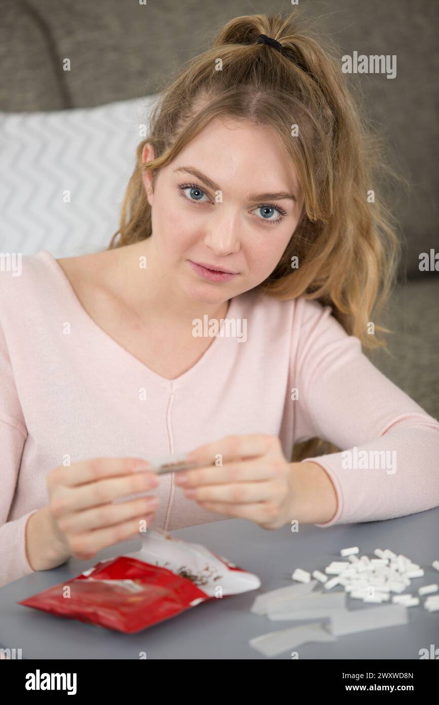 Girl rolling joint hi-res stock photography and images - Alamy