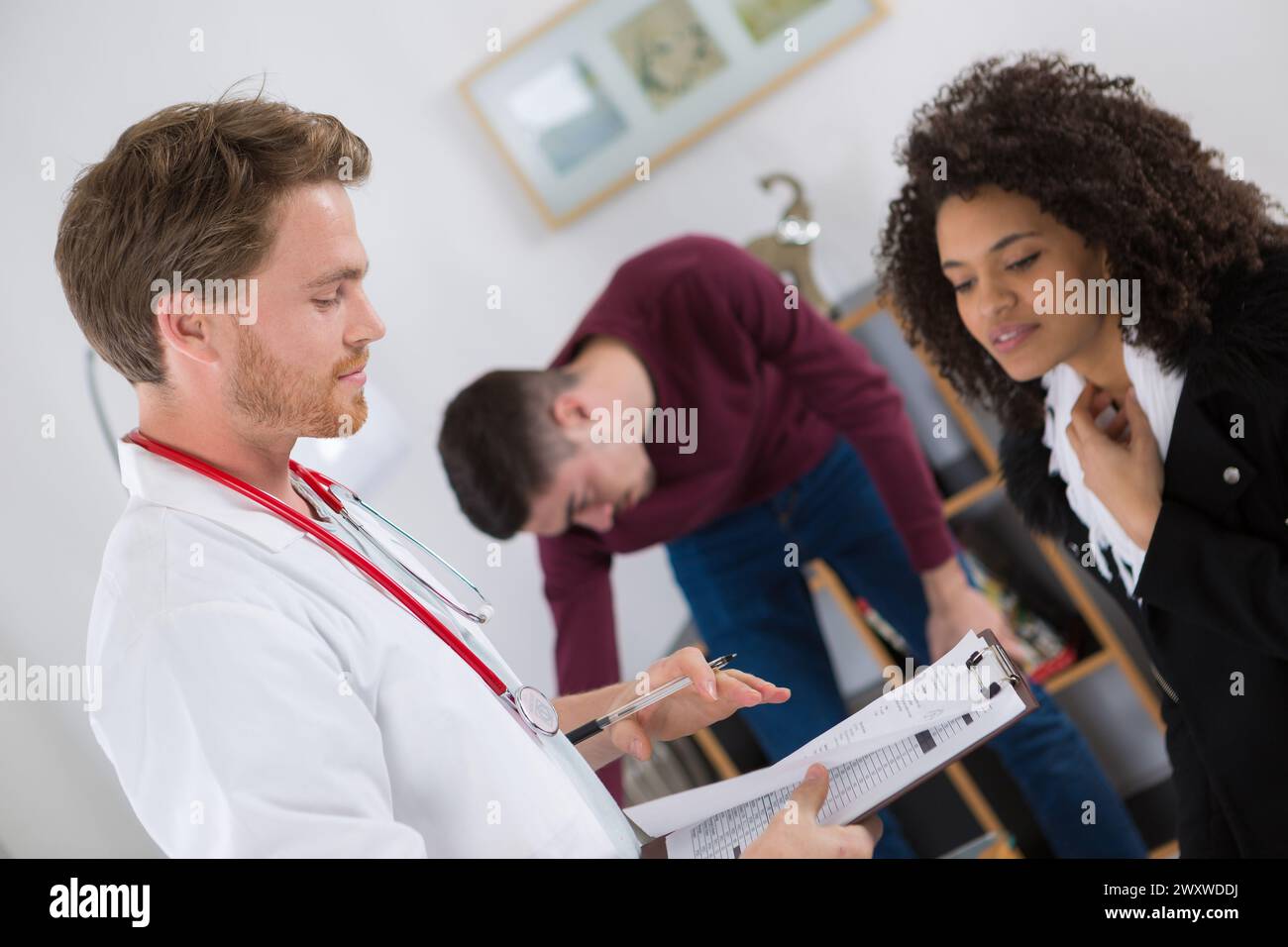 doctor calling the next patient Stock Photo - Alamy