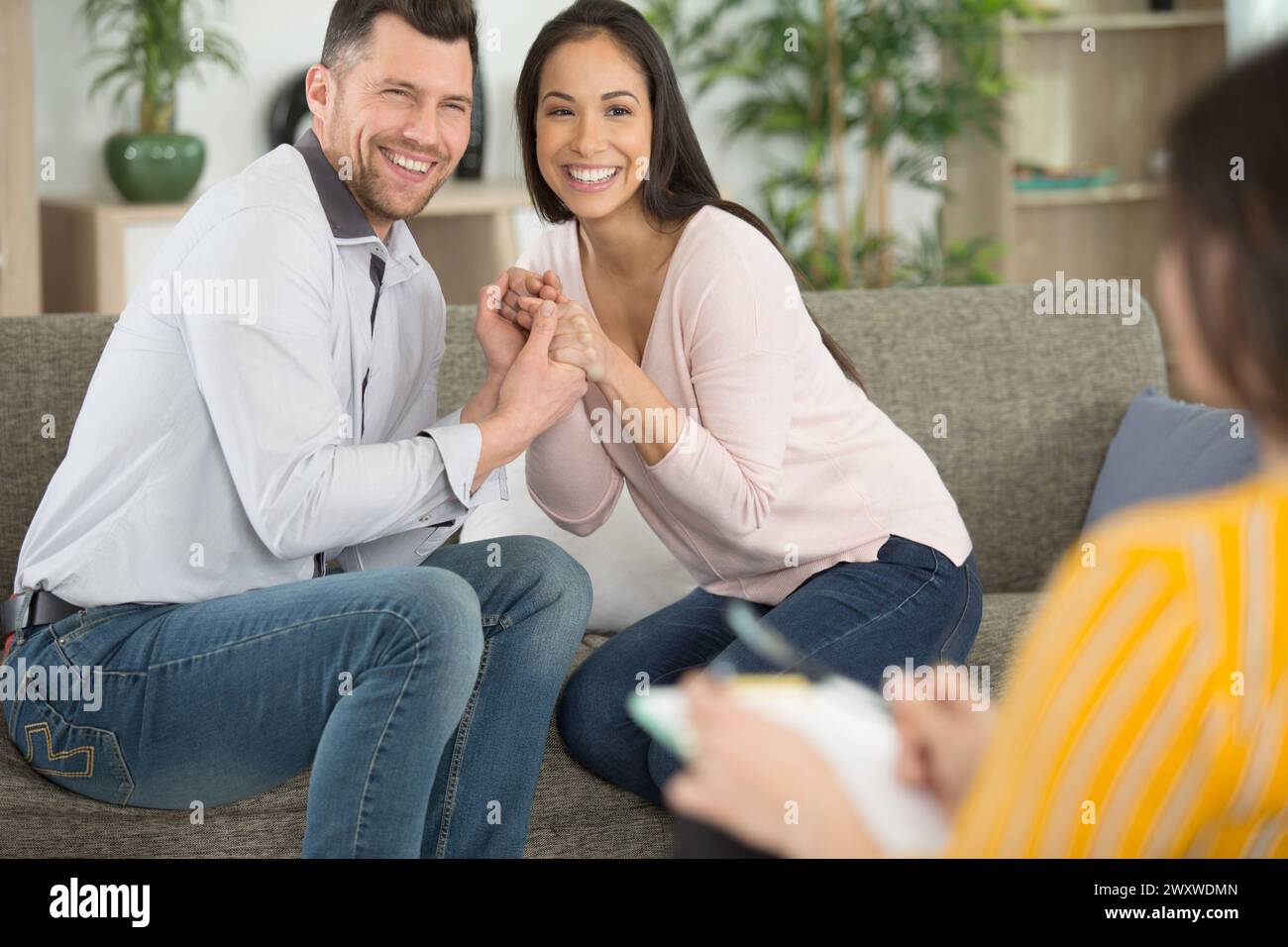 middle-aged couple solving problems during marital therapy with a ...