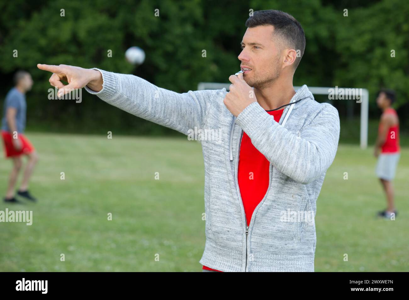 football referee blowing whistle during training Stock Photo - Alamy