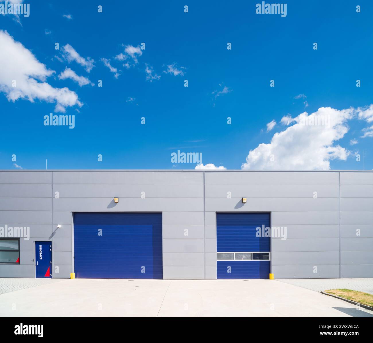 exterior of a modern warehouse with office unit Stock Photo - Alamy