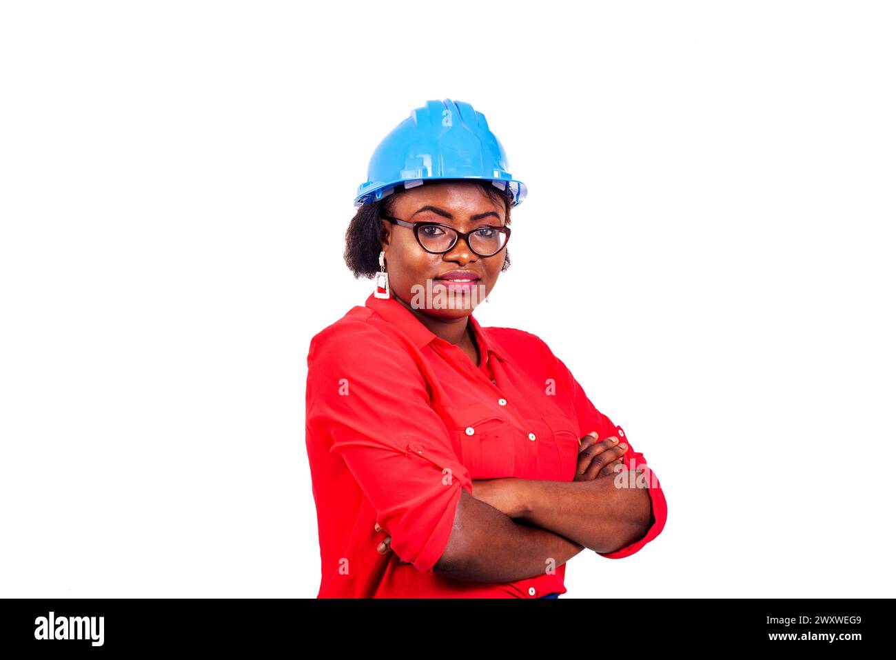 portrait of a beautiful adult female engineer wearing blue safety ...