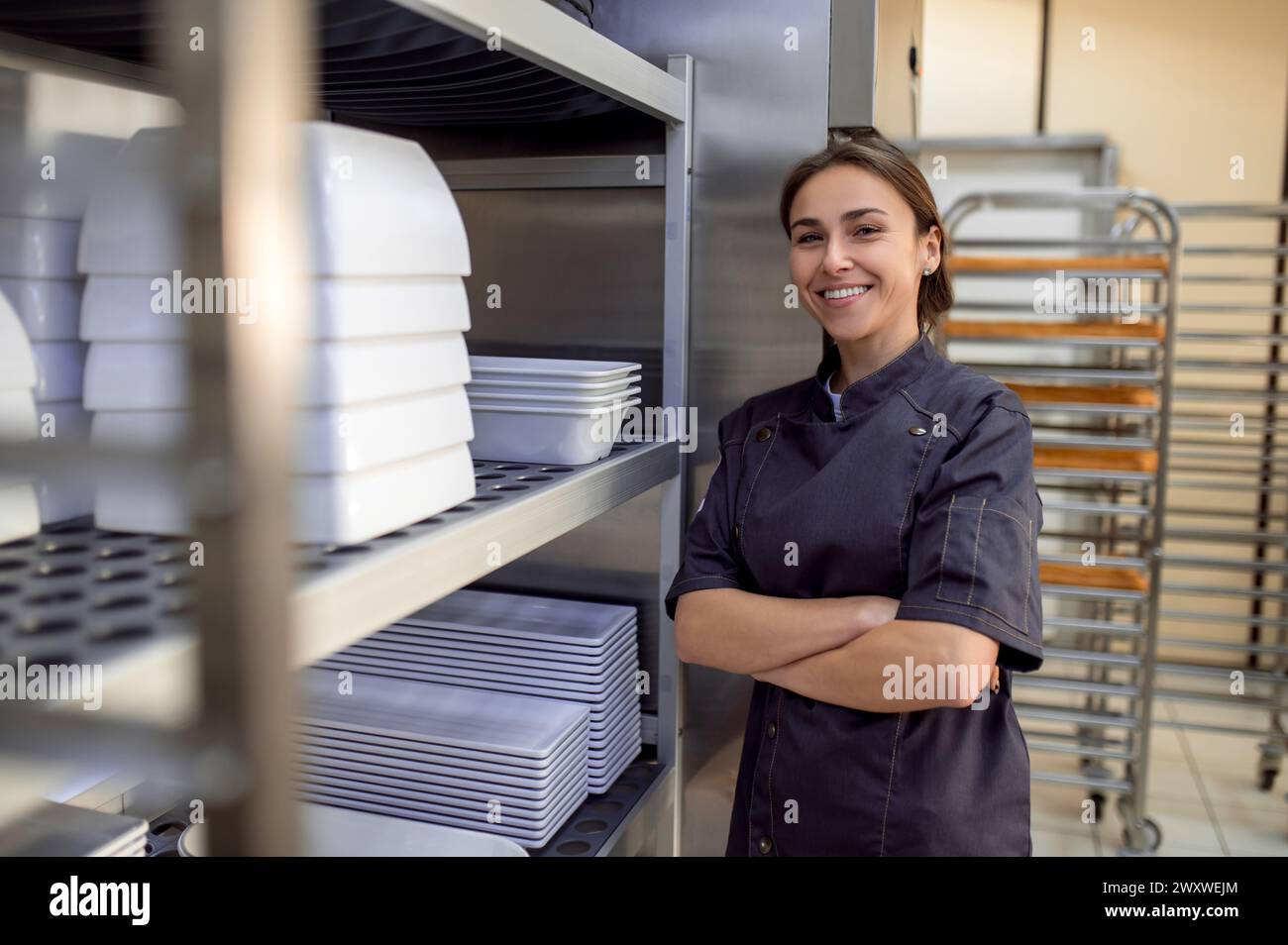 Woman professional baker posing at her workplace Stock Photo - Alamy