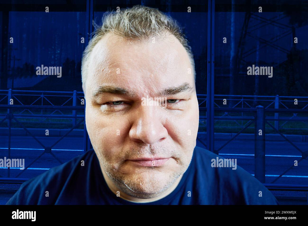 Feigned severity on face of an overweight European man, 47 years old ...