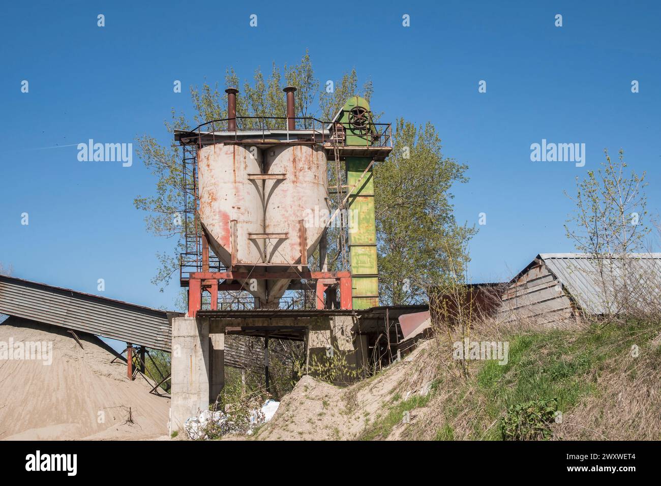 Old obsolete industrial facility for gravel pit sorting Stock Photo - Alamy